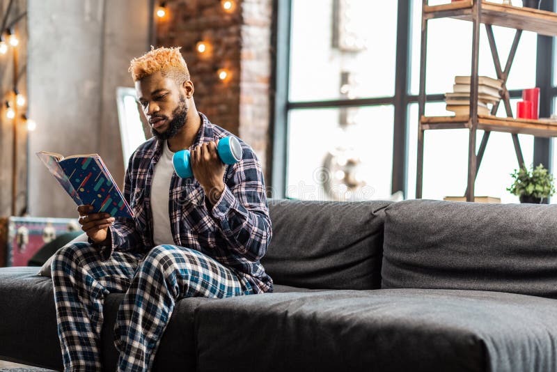 Serious Nice Man Doing a Physical Exercise Stock Photo - Image of ...