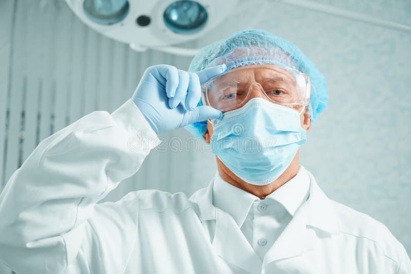 Serious older surgeon stock photo. Image of protective - 41521922