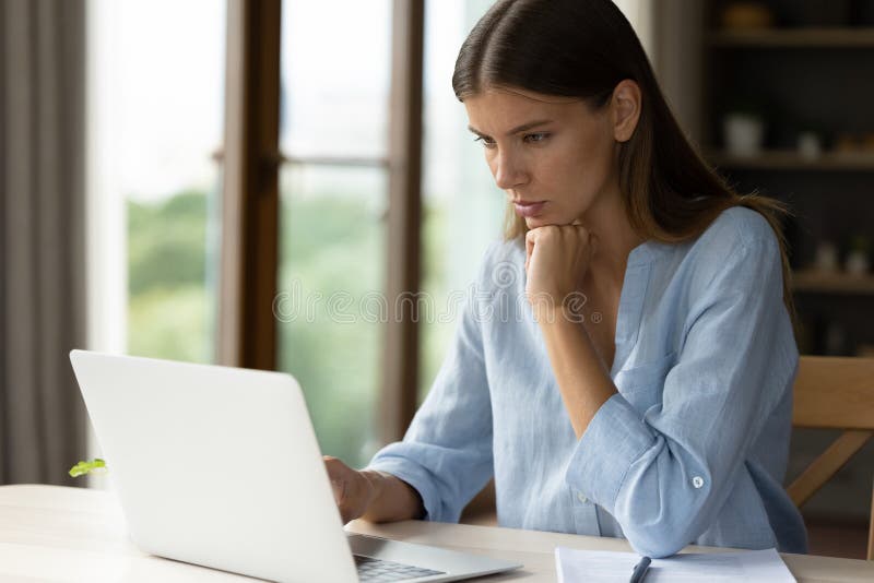 Serious Pensive Female Worker Thinking Over Work Task at Laptop Stock ...