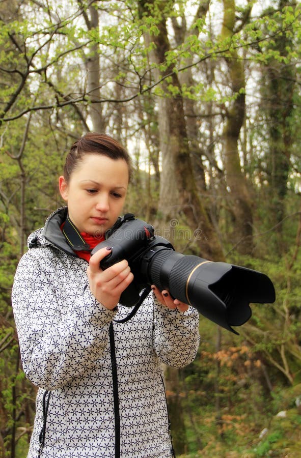Serious photographer stock photo. Image of woman, woods - 24256354