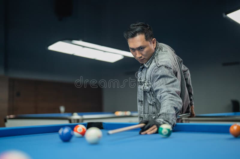 Serious Pool Player Poking the White Ball Stock Photo - Image of ...