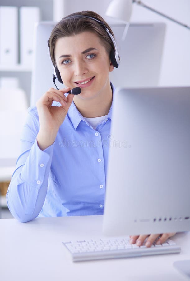 Serious Pretty Young Woman Working As Support Phone Operator with ...