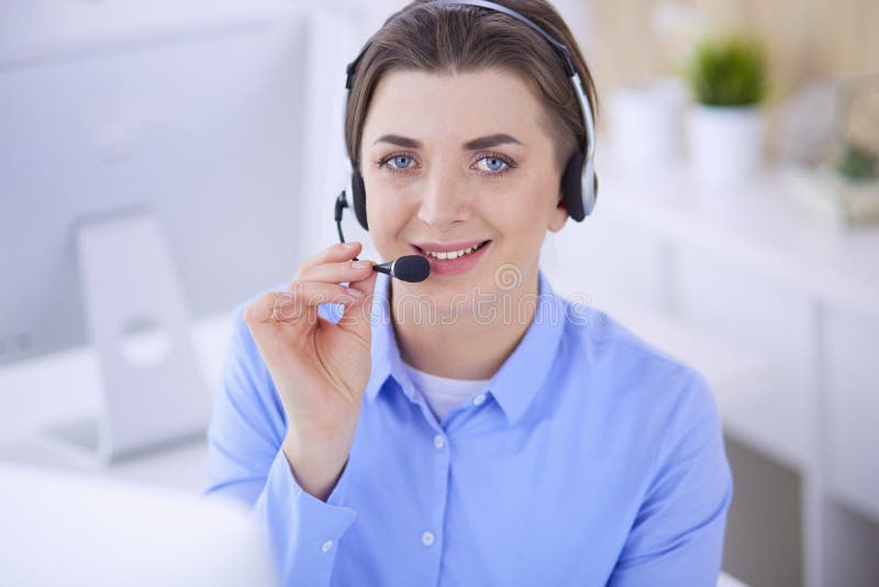 Serious Pretty Young Woman Working As Support Phone Operator with ...