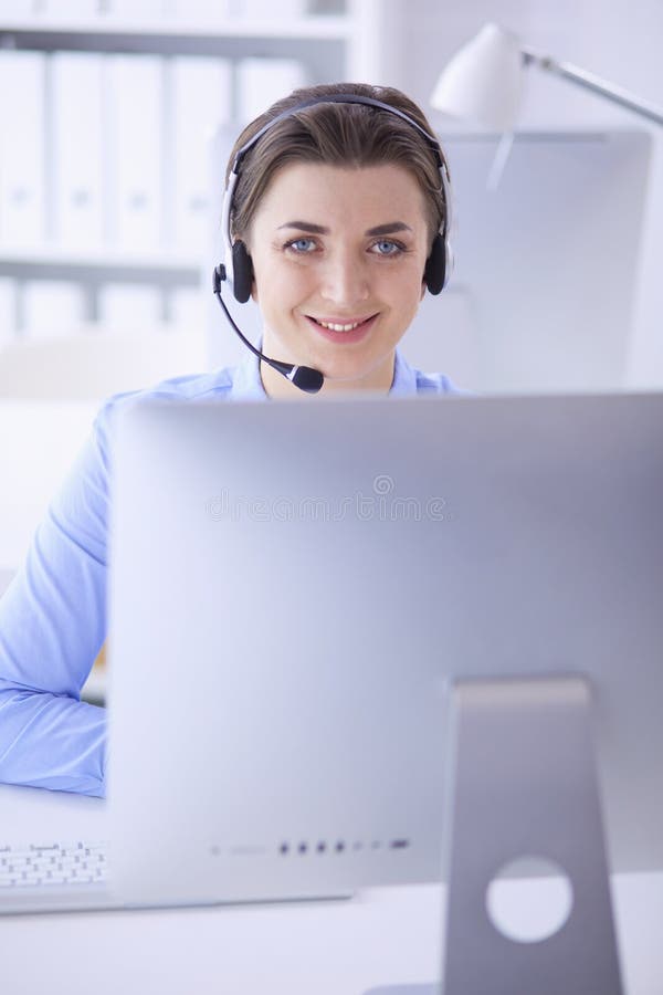 Serious Pretty Young Woman Working As Support Phone Operator with ...