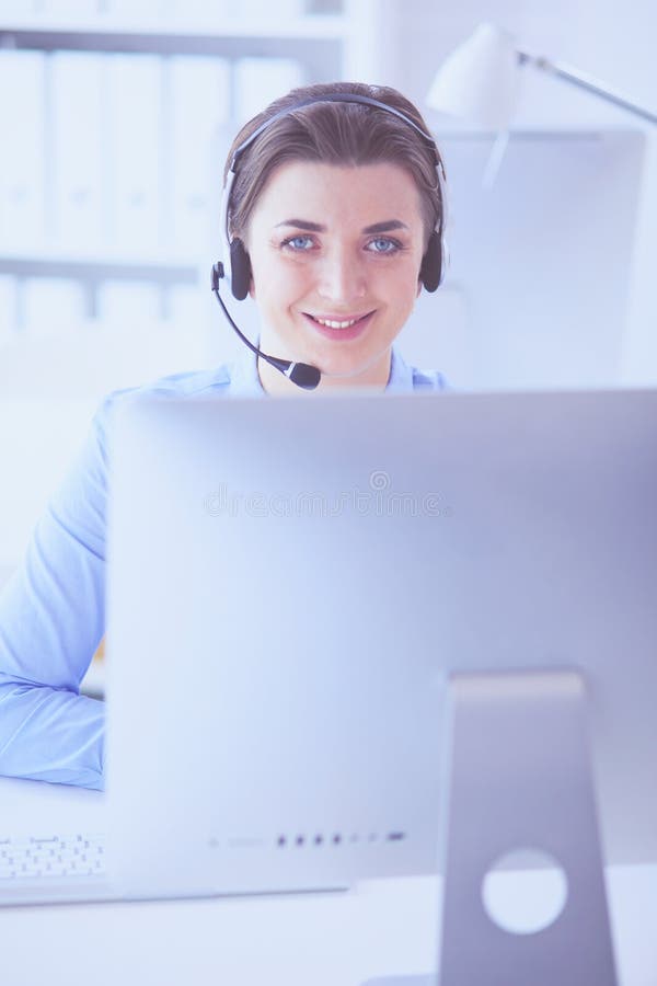 Serious Pretty Young Woman Working As Support Phone Operator with ...
