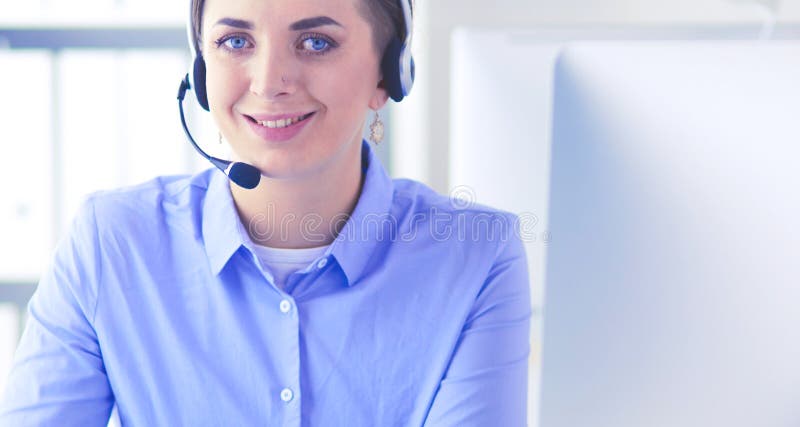 Serious Pretty Young Woman Working As Support Phone Operator with ...