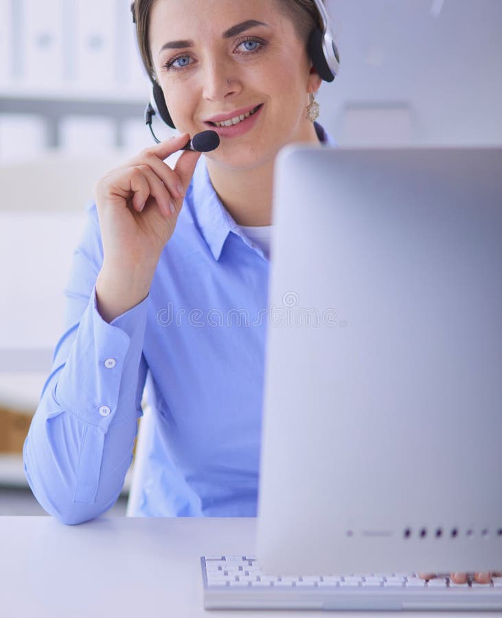 Serious Pretty Young Woman Working As Support Phone Operator with ...