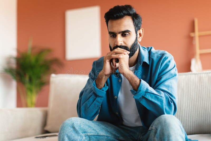 Depressed Indian Man Thinking about His Issues Sitting at Home Stock ...