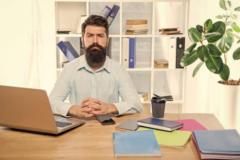 Serious Professional Man Sitting at Office Desk Clasping Hands ...