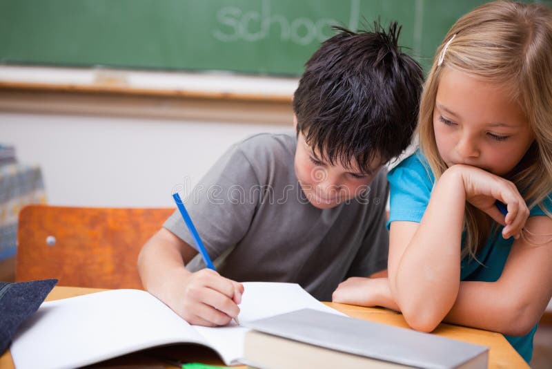 Serious Pupils Working Together Stock Photo - Image of learning, happy ... Serious Pupils Working Together Stock Photo - Image of learning, happy ...