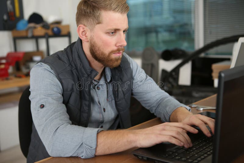 Serious Repairman in Working in Office Stock Photo - Image of fixing ...