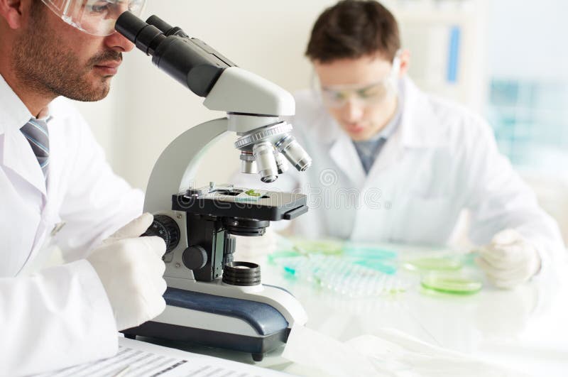 Serious researcher stock image. Image of microscope, medicine - 34211461