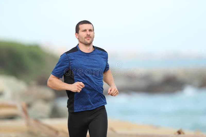 Serious Runner Running Working Out on the Beach Stock Photo - Image of ...