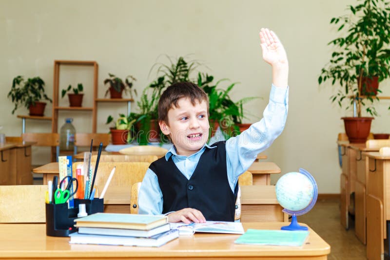 Serious Schoolboy in the Classroom Stock Photo - Image of distance ...