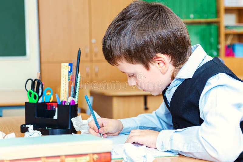 Serious Schoolboy in the Classroom Stock Photo - Image of person ...