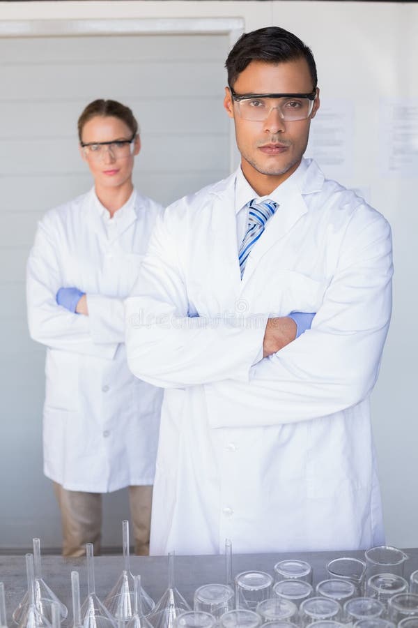 Two Serious Scientists in Hazmat Suits Standing in the Research Lab ...