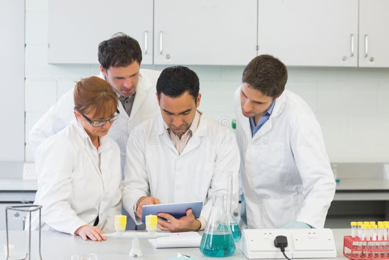 Serious Scientists Using Tablet PC in the Lab Stock Image - Image of ...