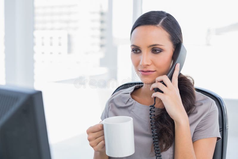 Serious Secretary Calling with a Headset Stock Photo - Image of adult ...