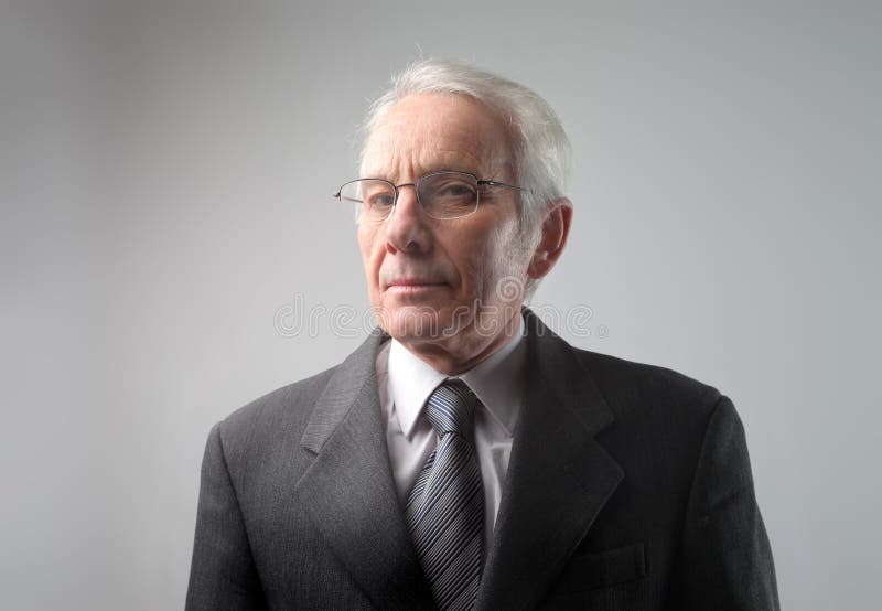 Serious senior businessman stock image. Image of business - 12878481