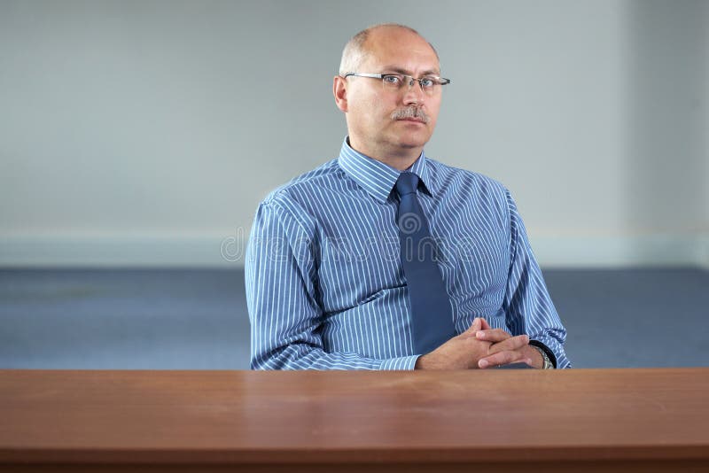 Serious Senior Businessman Sits Behind Empty Desk Stock Image - Image ...