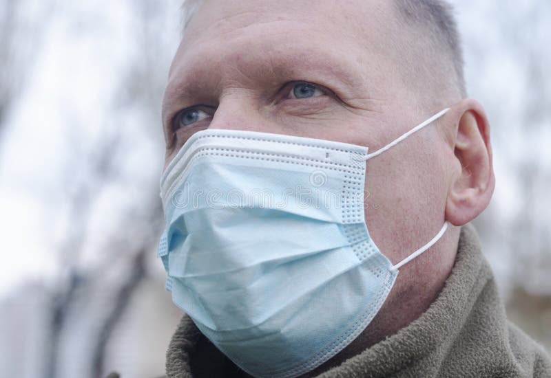 Serious Senior Man in Blue Face Mask, Close Up of Head Stock Photo ...