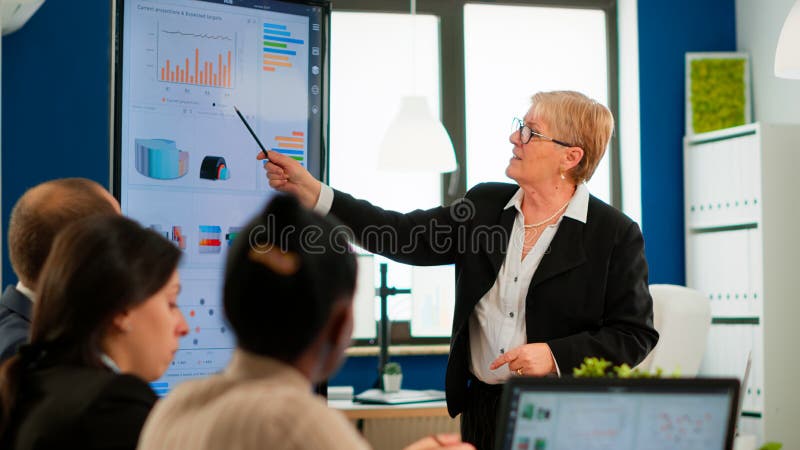Serious Senior Manager Executive and Diverse Team People Analyzing ...