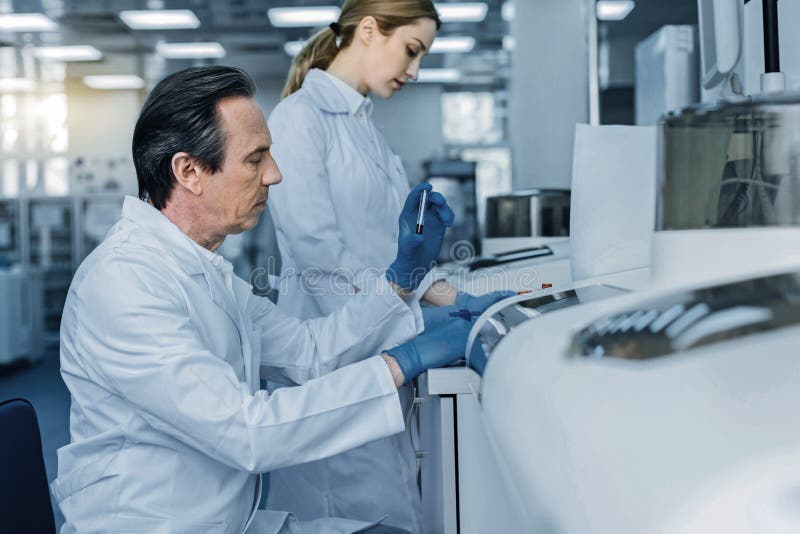 Serious Smart Scientists Doing a Research Together Stock Photo - Image ...