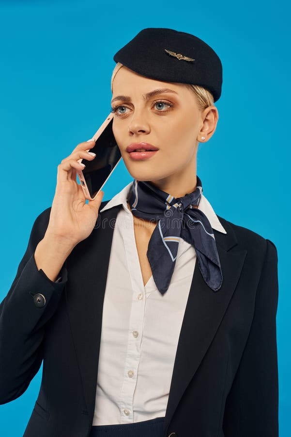 Serious Stewardess in Elegant Uniform Talking Stock Photo - Image of ...