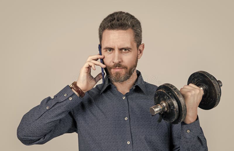 Serious Strong Bearded Man Businessman Training with Barbell and ...