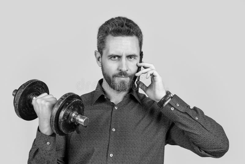 Serious Strong Bearded Man Businessman Training with Barbell and ...