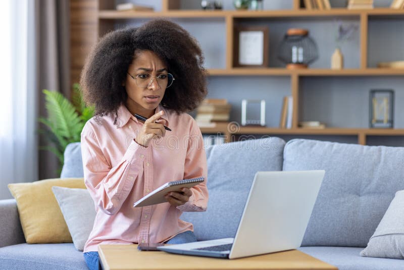 Serious Student Focused on Online Learning with Laptop and Notebook ...