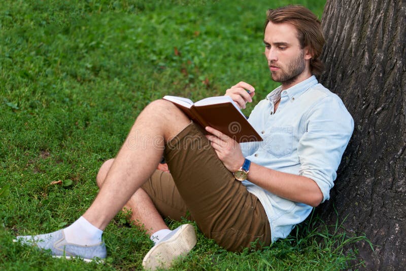 Serious Student in Park of Campus Read a Book Stock Image - Image of ...