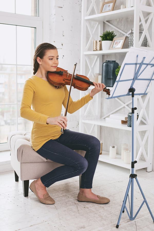 Serious Student Sitting in Front of Reading-stand Stock Photo - Image ...