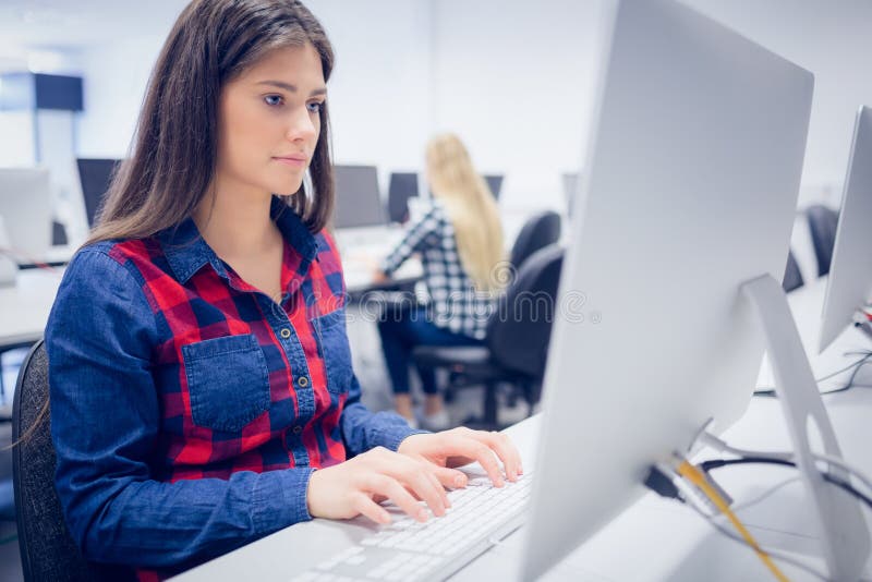 Serious Student Working with a Computer Stock Photo - Image of learning ...