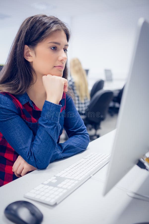 Serious Student Working on Computer Stock Image - Image of classroom ...