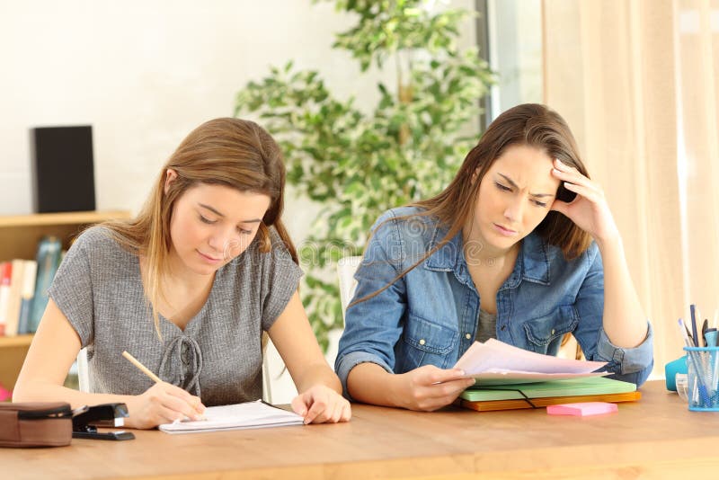 Serious Students Doing Homework at Home Stock Photo - Image of ...