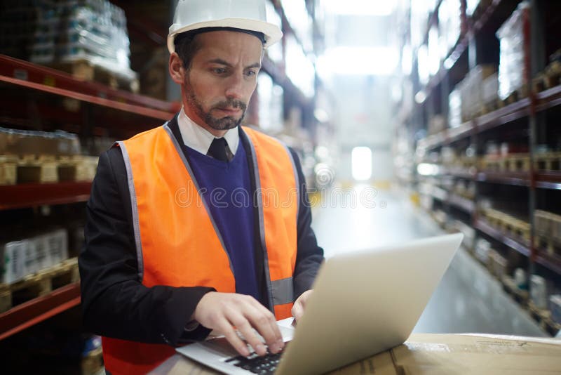 Warehouse Supervisor Managing Work Operations Stock Image - Image of ...