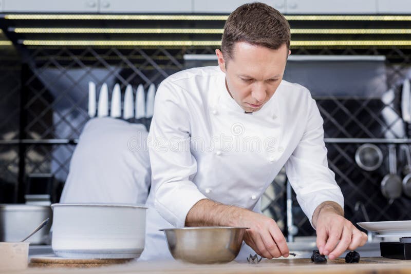 Serious Talented Cook Making a Dish Delicious Stock Photo - Image of ...