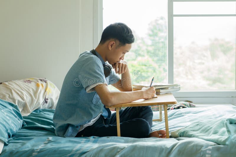 Serious Teenage Asian Boy Study at Home Stock Image - Image of college ...