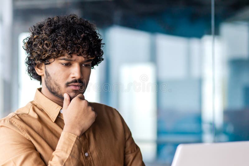 Serious Thinking Businessman Inside the Office at the Workplace, the ...
