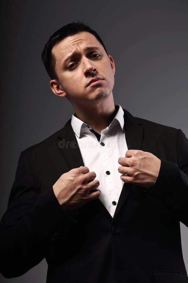 Serious Thinking Man Looking in Black Suit on Grey Studio Background ...