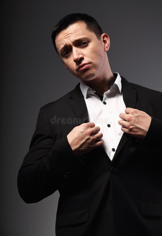 Serious Thinking Man Looking in Black Suit on Grey Studio Background ...