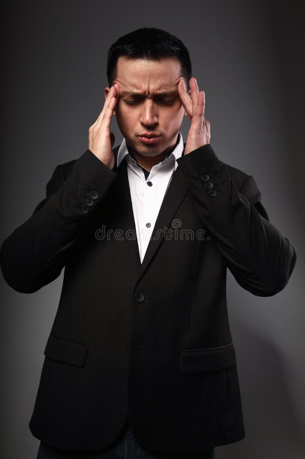 Serious Thinking Man with Thought-transference Abilities Holding the ...