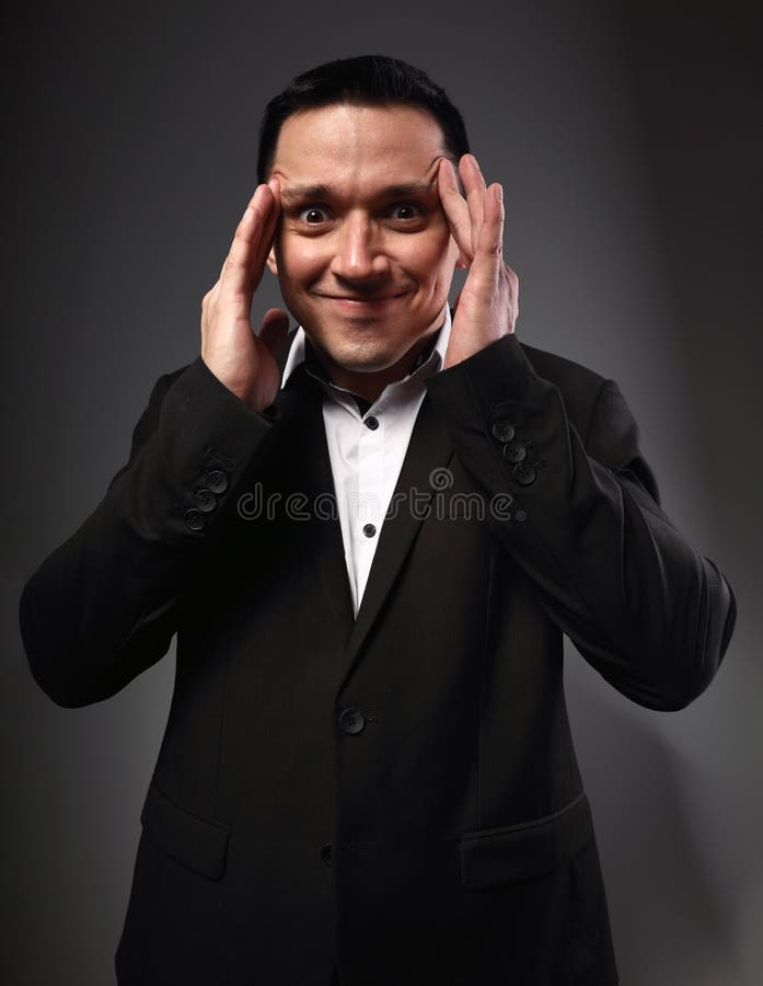 Serious Thinking Man with Thought-transference Abilities Holding the ...