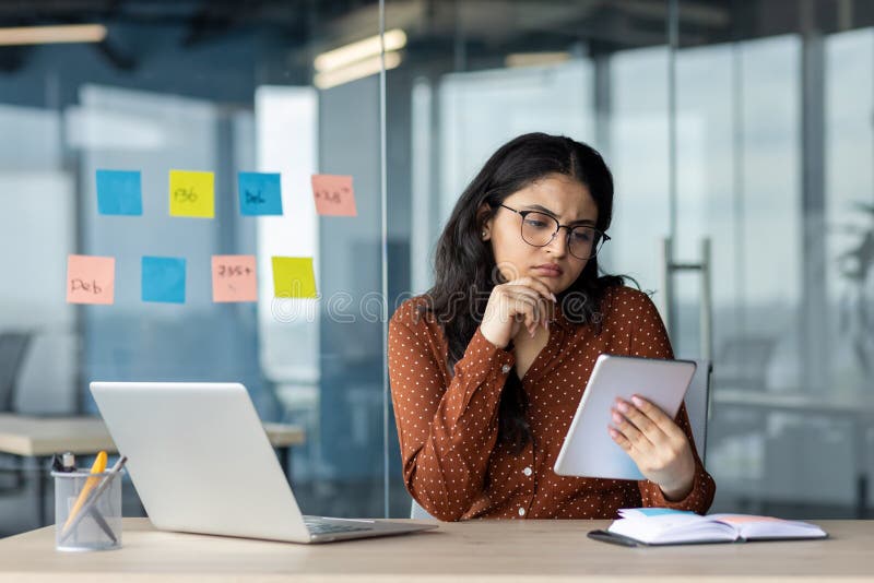 Serious Thinking Woman Using Tablet Computer. Businesswoman ...