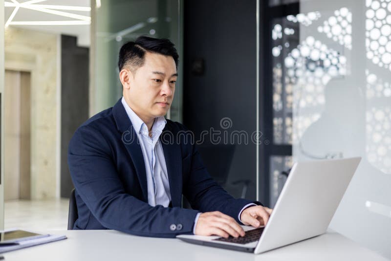 Serious and Thoughtful Businessman Working Inside Office Sitting at ...