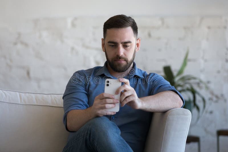 Serious Thoughtful Smartphone User Man Typing, Reading Message on Cell ...