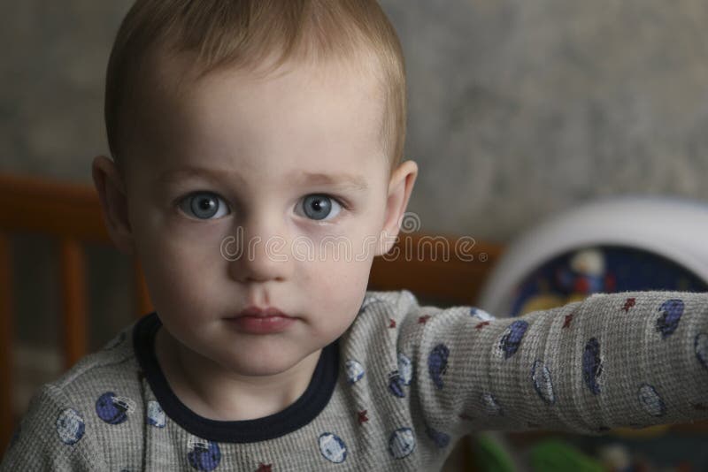 Serious Toddler stock image. Image of crib, baby, face - 5337919