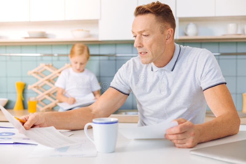 Serious Unhappy Man Reading a Document Stock Photo - Image of caucasian ...