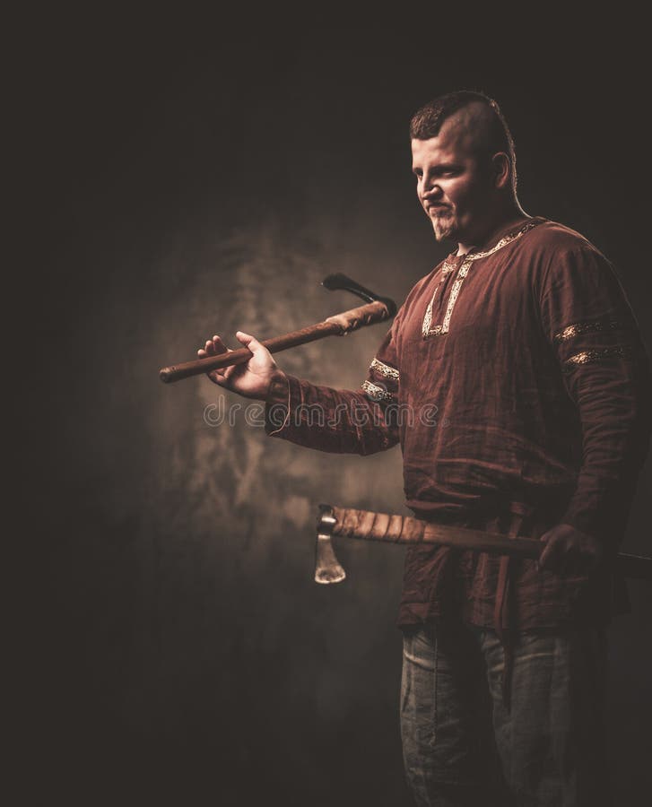 Angry Viking in a Traditional Warrior Clothes, Posing on a Dark ...